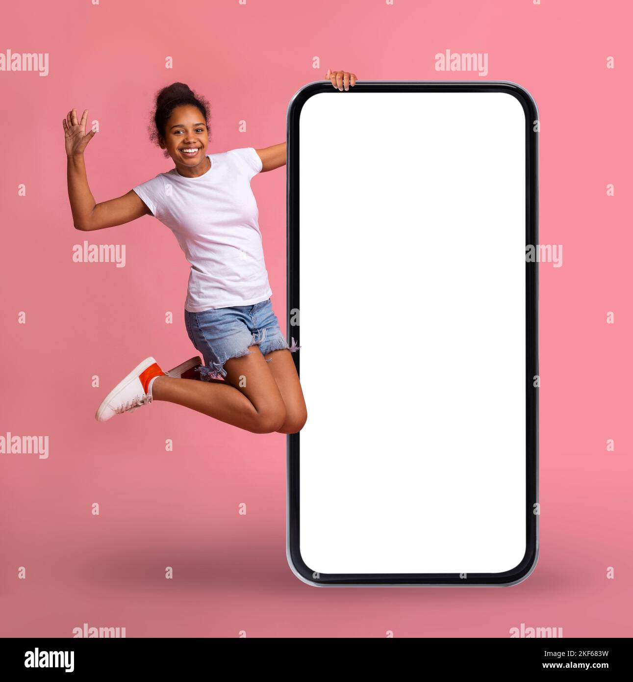 Teen smartphone jumping hi-res stock photography and images - Alamy