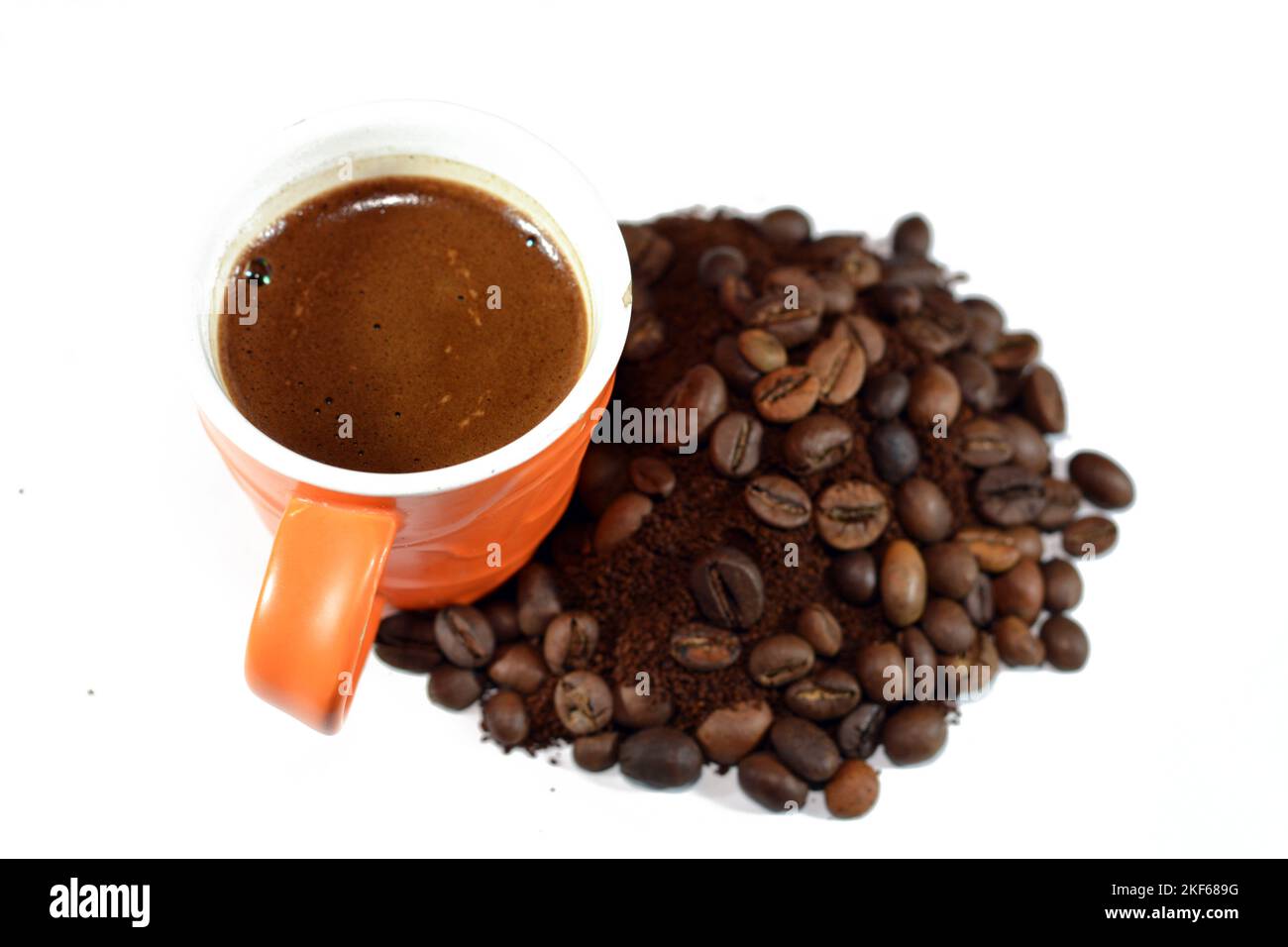 A cup of Turkish coffee with coffee beans, seeds of the Coffea plant ...