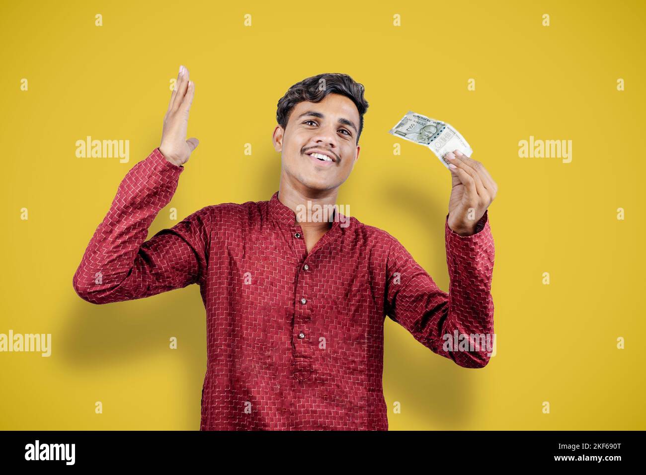 indian man holding indian currency Stock Photo - Alamy