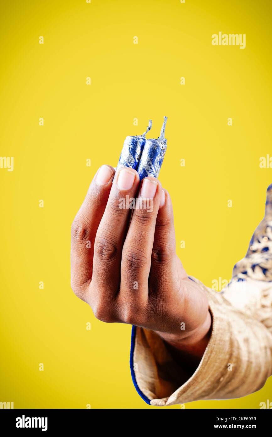Indian man holding firecrackers in his hands, indian festival concepts ...