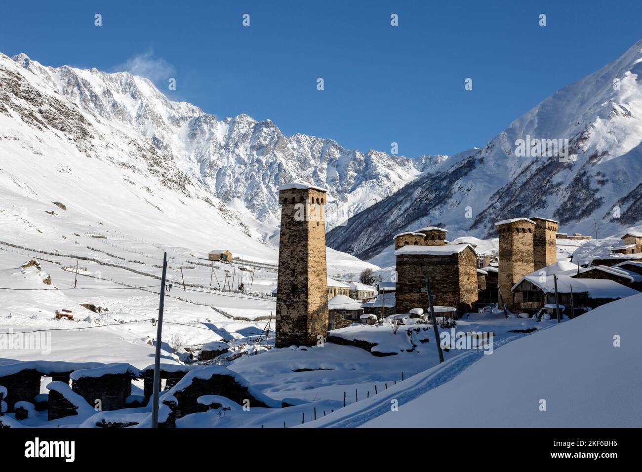 Svan towers in front of Mount Shkhara is a nine summit mountain, one of ...