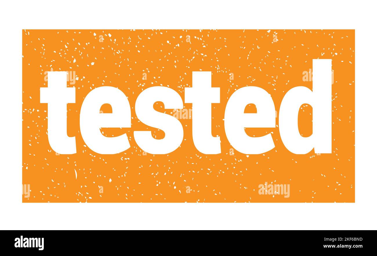 tested text written on orange grungy stamp sign Stock Photo - Alamy