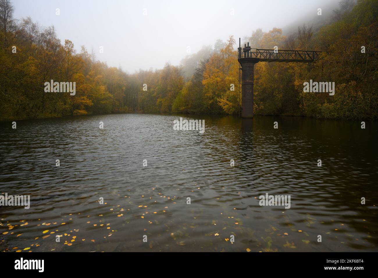 Reservoir with autumn trees and mist Stock Photo - Alamy