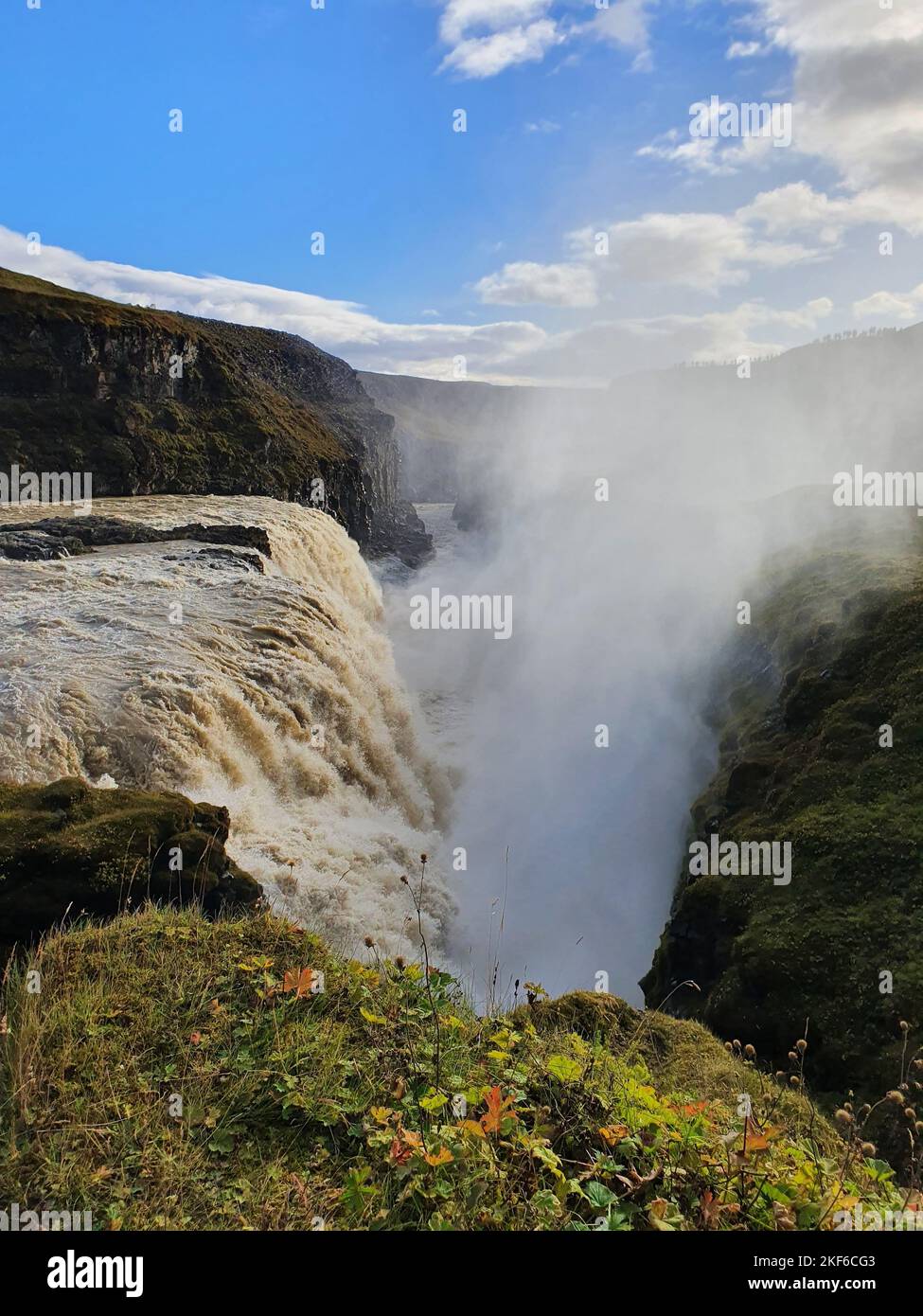 A vertical shot of the Gullfoss waterfall in Iceland on a sunny day ...