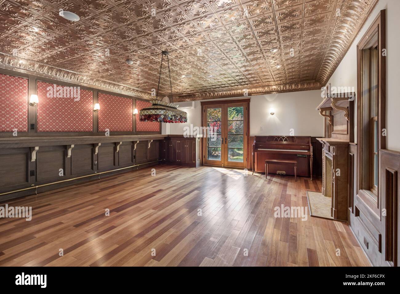 A beautiful empty room with laminate flooring and a wooden interior in ...