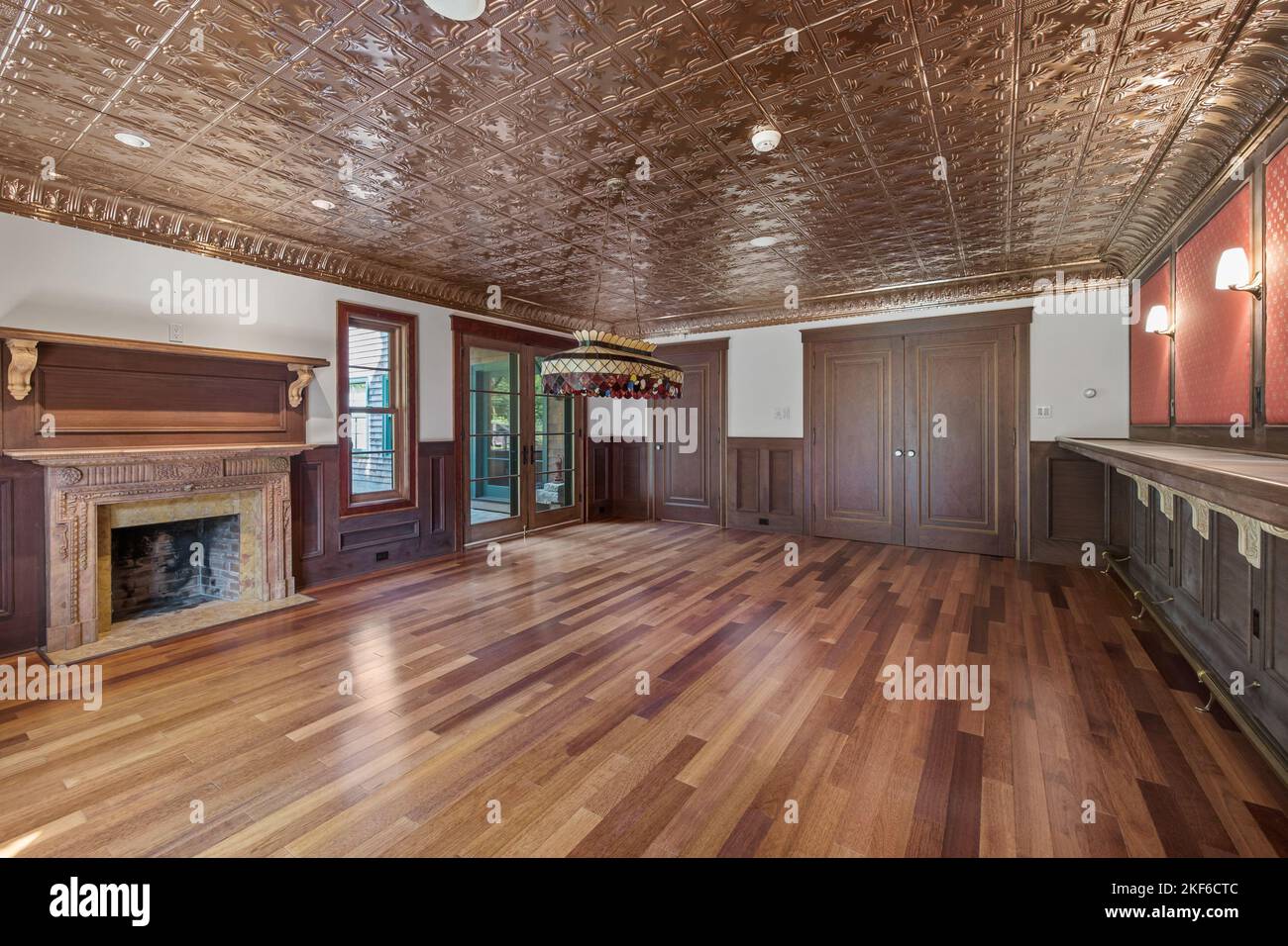 A beautiful empty room with laminate flooring and a wooden interior in ...