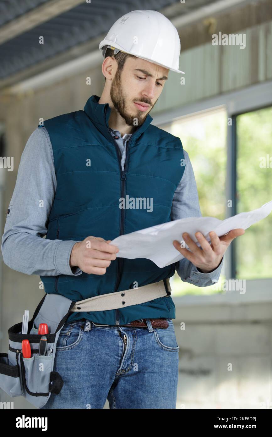 builder man checks the project Stock Photo - Alamy