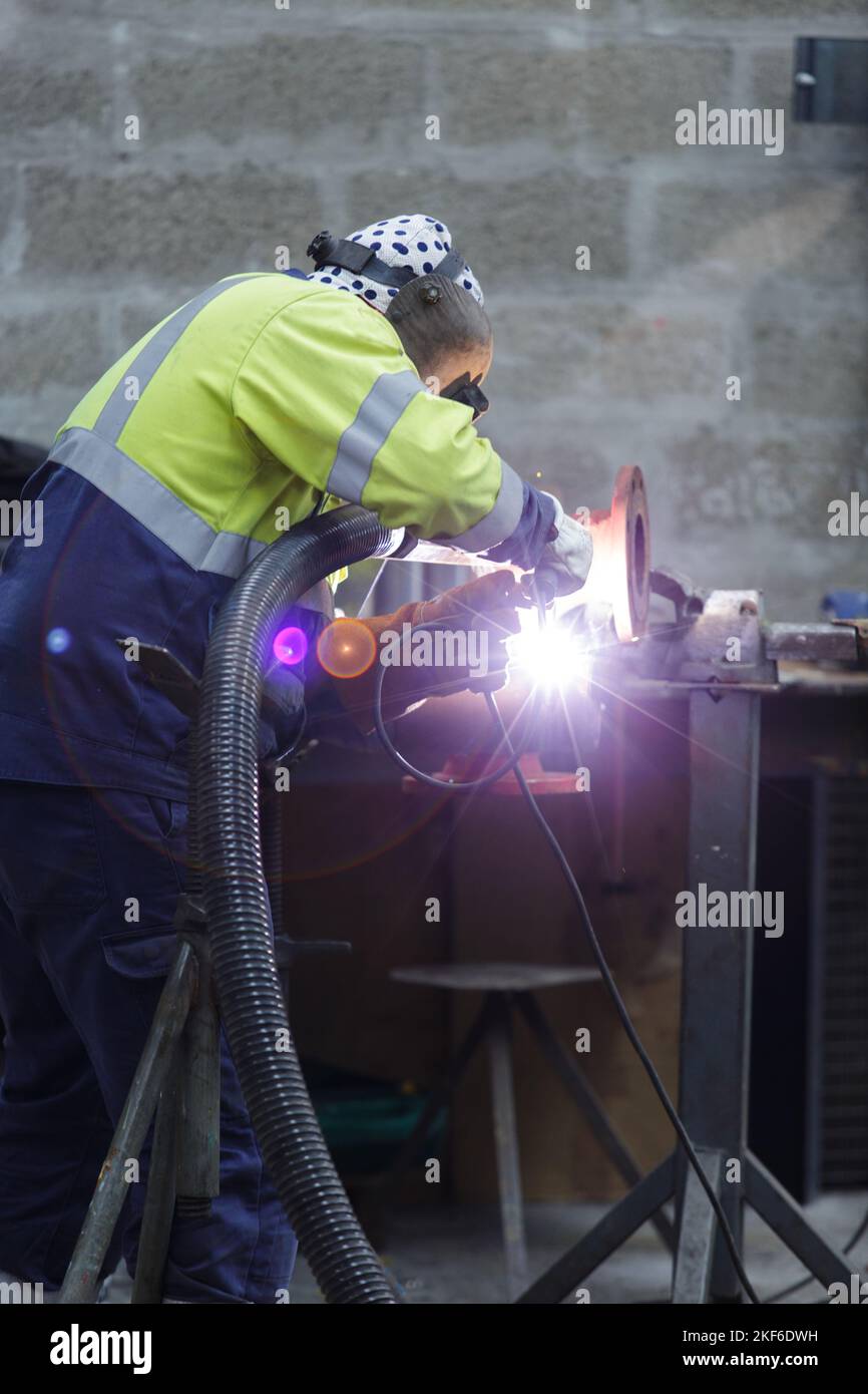 person welding in a workshop Stock Photo - Alamy