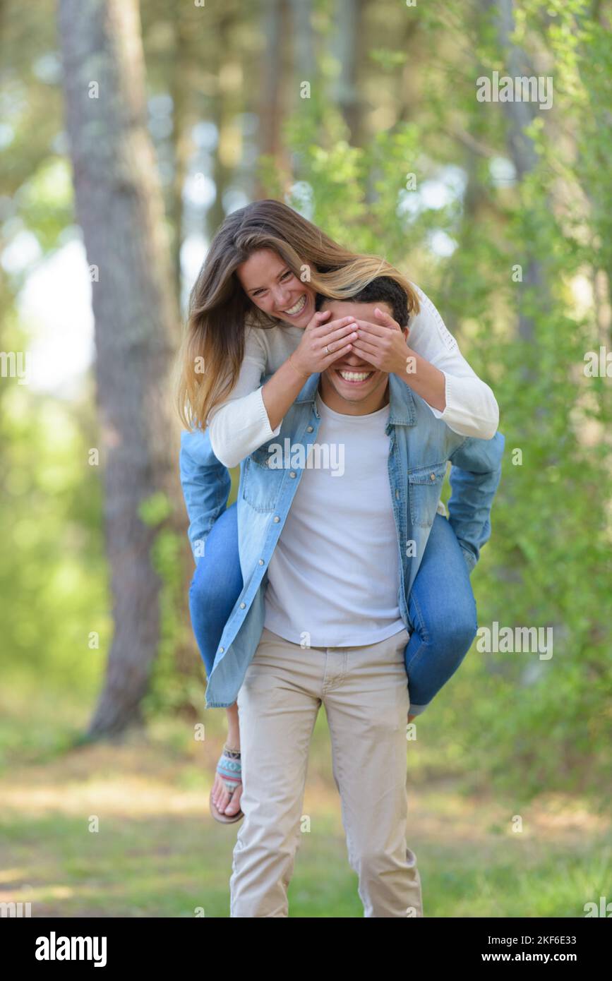 Cute young couple doing piggyback hi-res stock photography and images ...