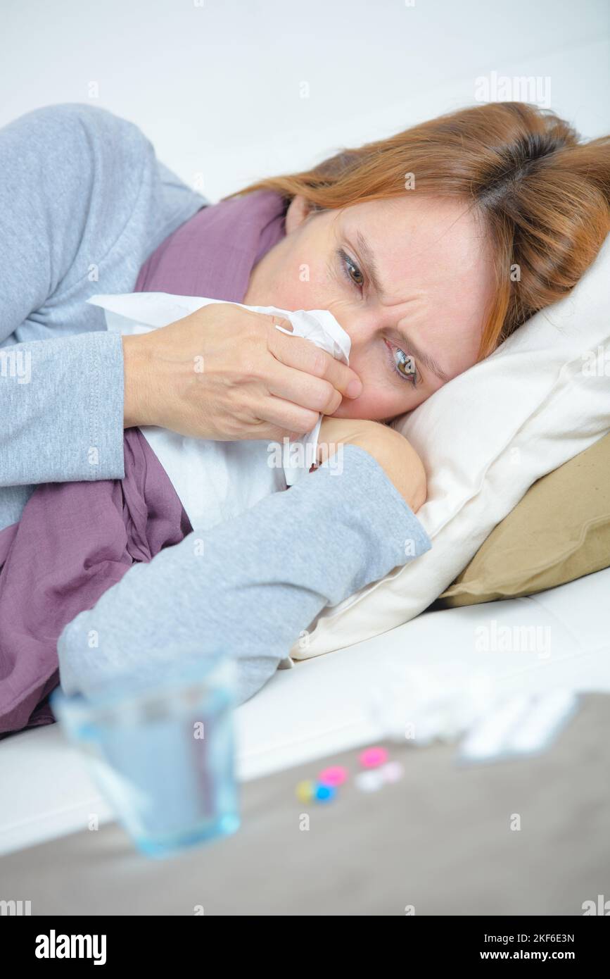 woman lying down with colds Stock Photo - Alamy
