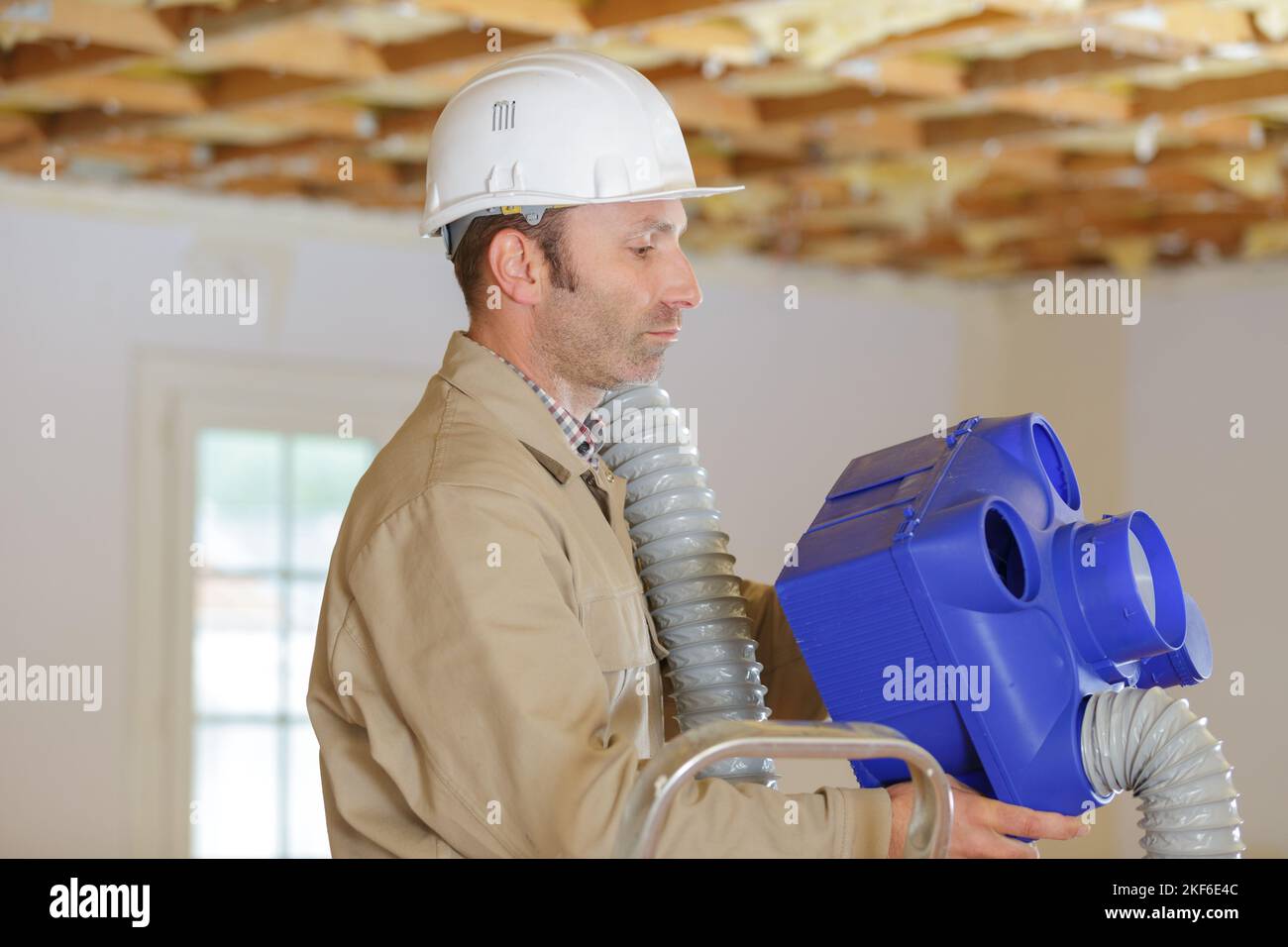 working on ventilation of a site Stock Photo - Alamy