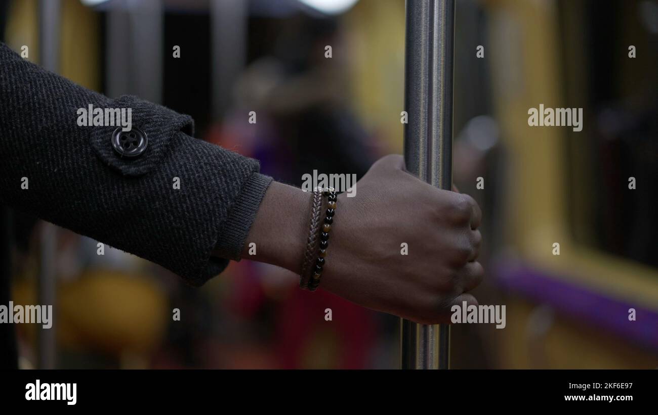 Close-up hand holding on metro subway bar handrail Stock Photo - Alamy