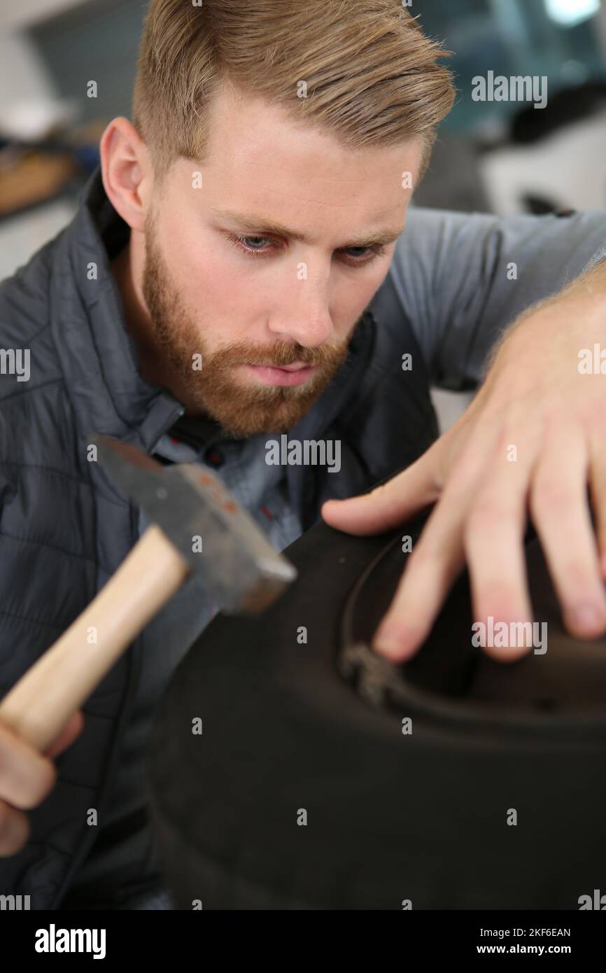 Man holding a hammer hi-res stock photography and images - Alamy