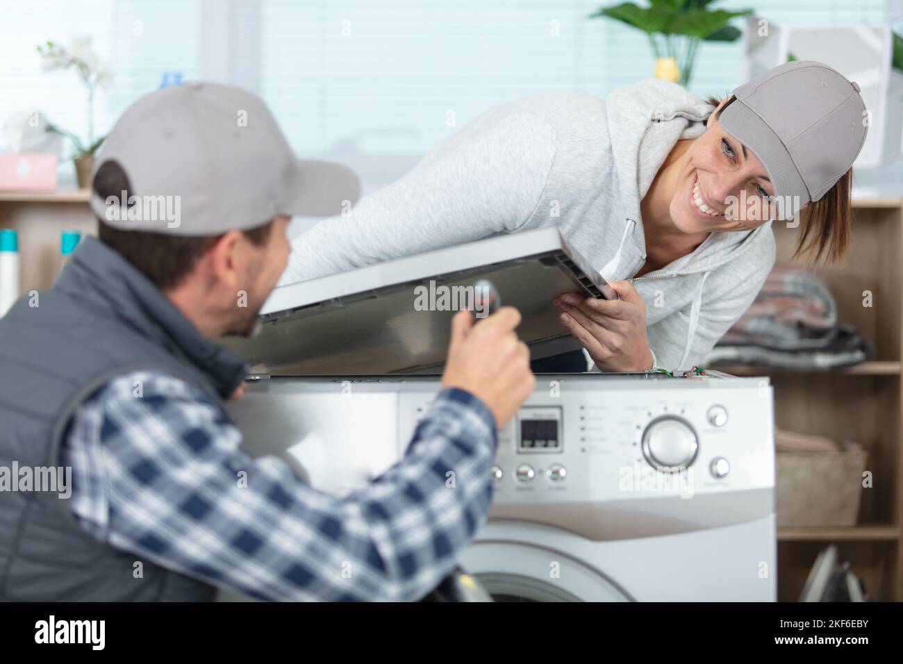 Woman watching man washing hi-res stock photography and images - Alamy
