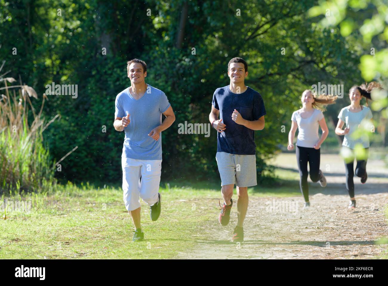 Woman trail running through green hi-res stock photography and images ...