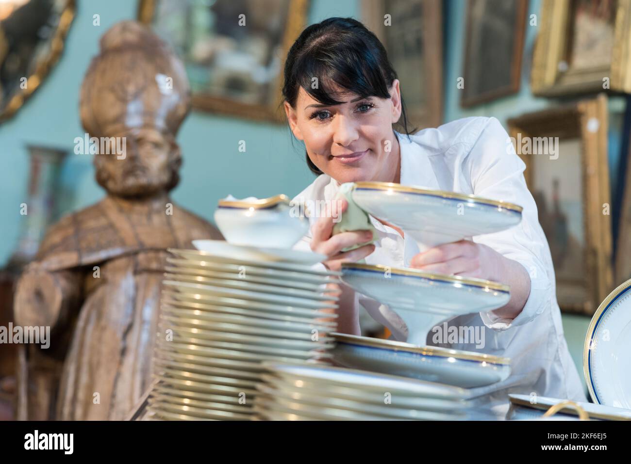 portrait of a female antique collector posing Stock Photo - Alamy