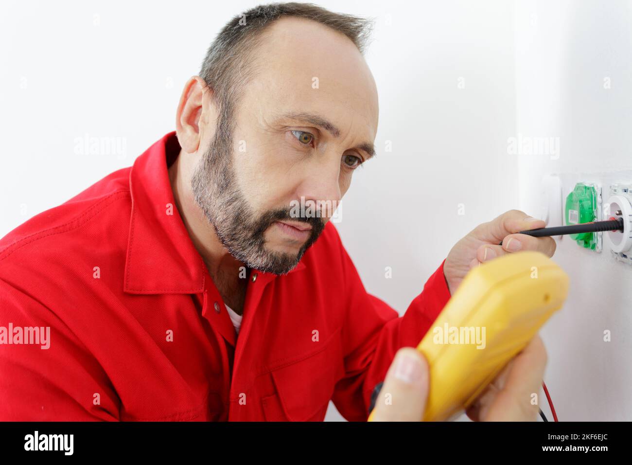 electrician technician at work on a residential electrical panel Stock ...