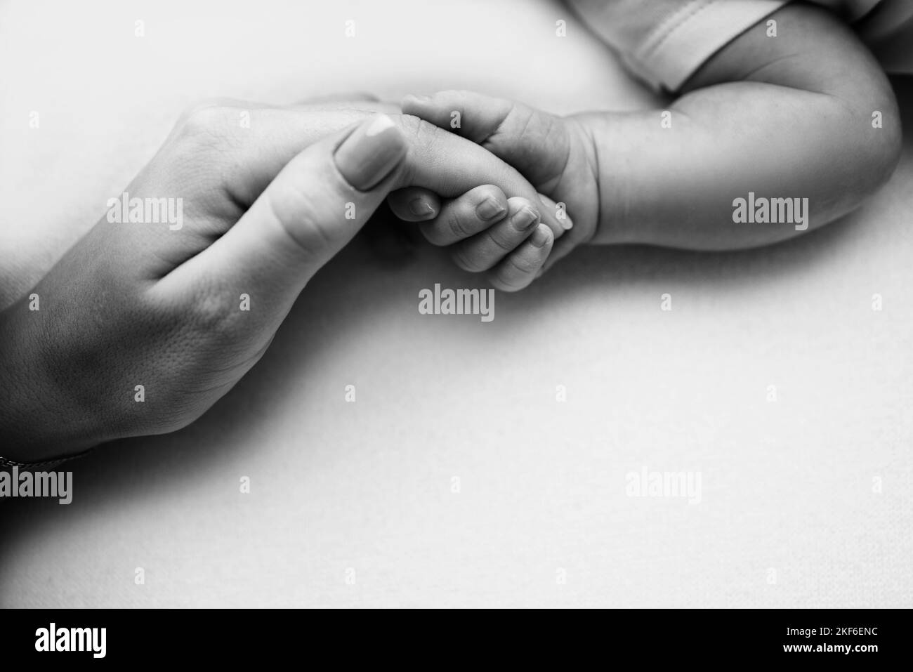 Close-up little hand of child and palm of mother and father. The ...