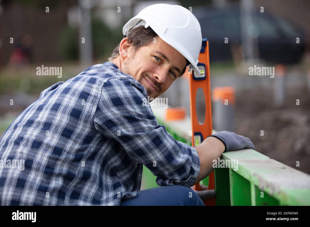 plumber checking foundation leveling using spirit level Stock Photo - Alamy
