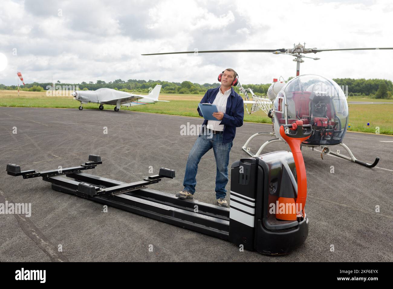 man works on an helicopter deck offshore Stock Photo - Alamy
