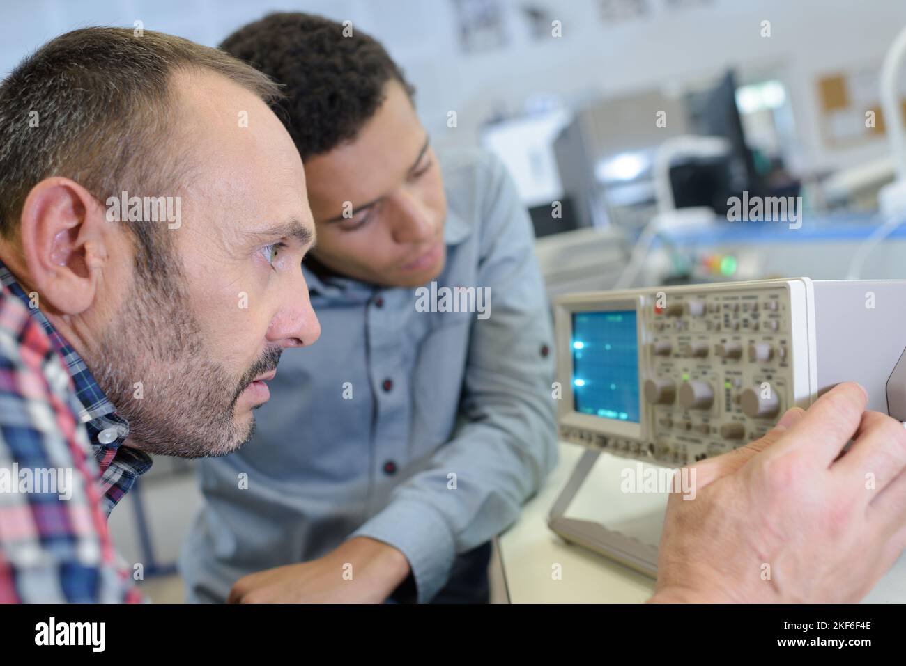 worker setting up ultrasonic reader Stock Photo - Alamy