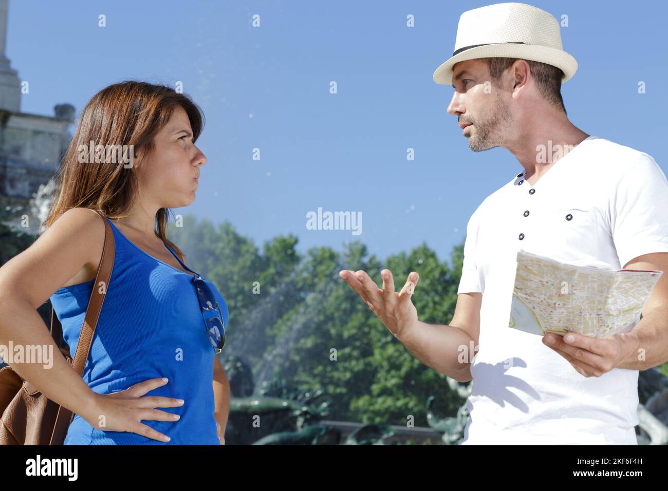 couple arguing with a map Stock Photo - Alamy