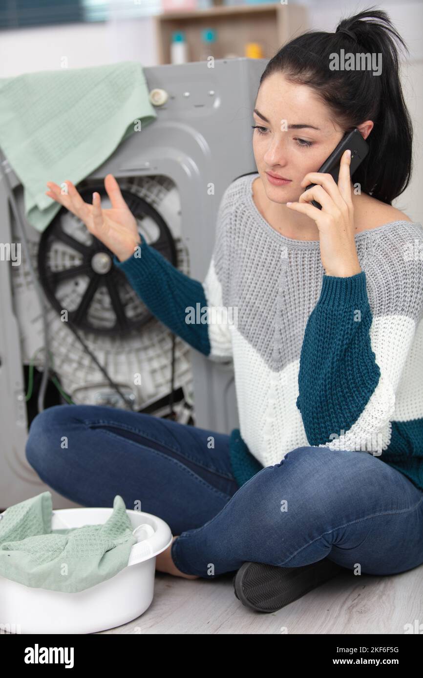Woman repair domestic appliance hi-res stock photography and images - Alamy