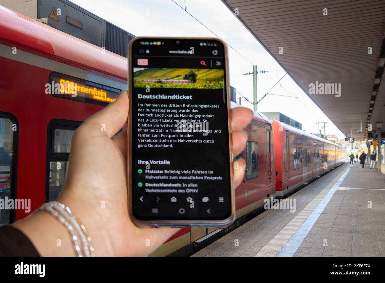 Symbol image Deutschlandticket, 49-Euro-Ticket: Close-up of a smartphone in front of passengers ...