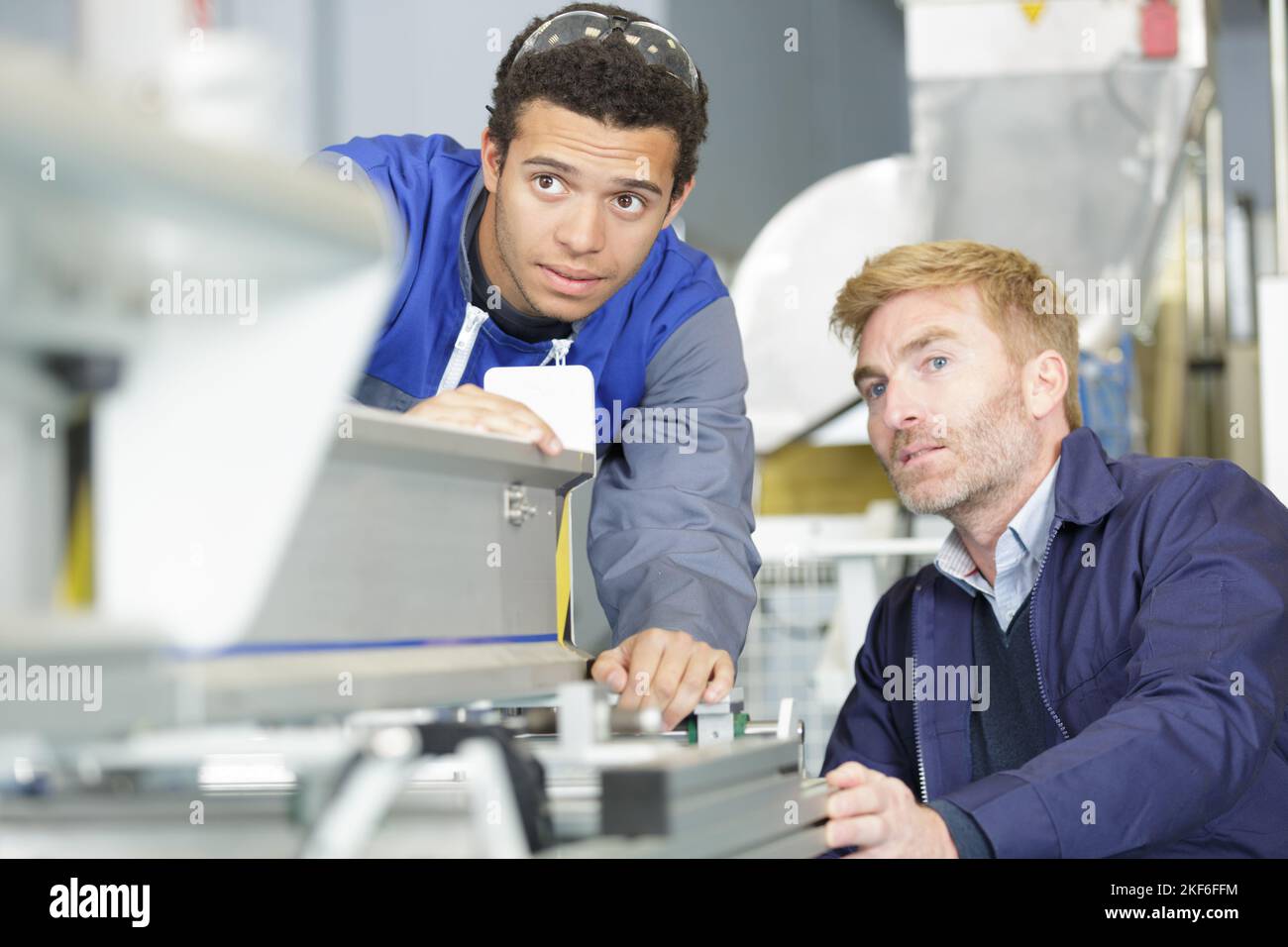 two men different ages professional labours Stock Photo - Alamy
