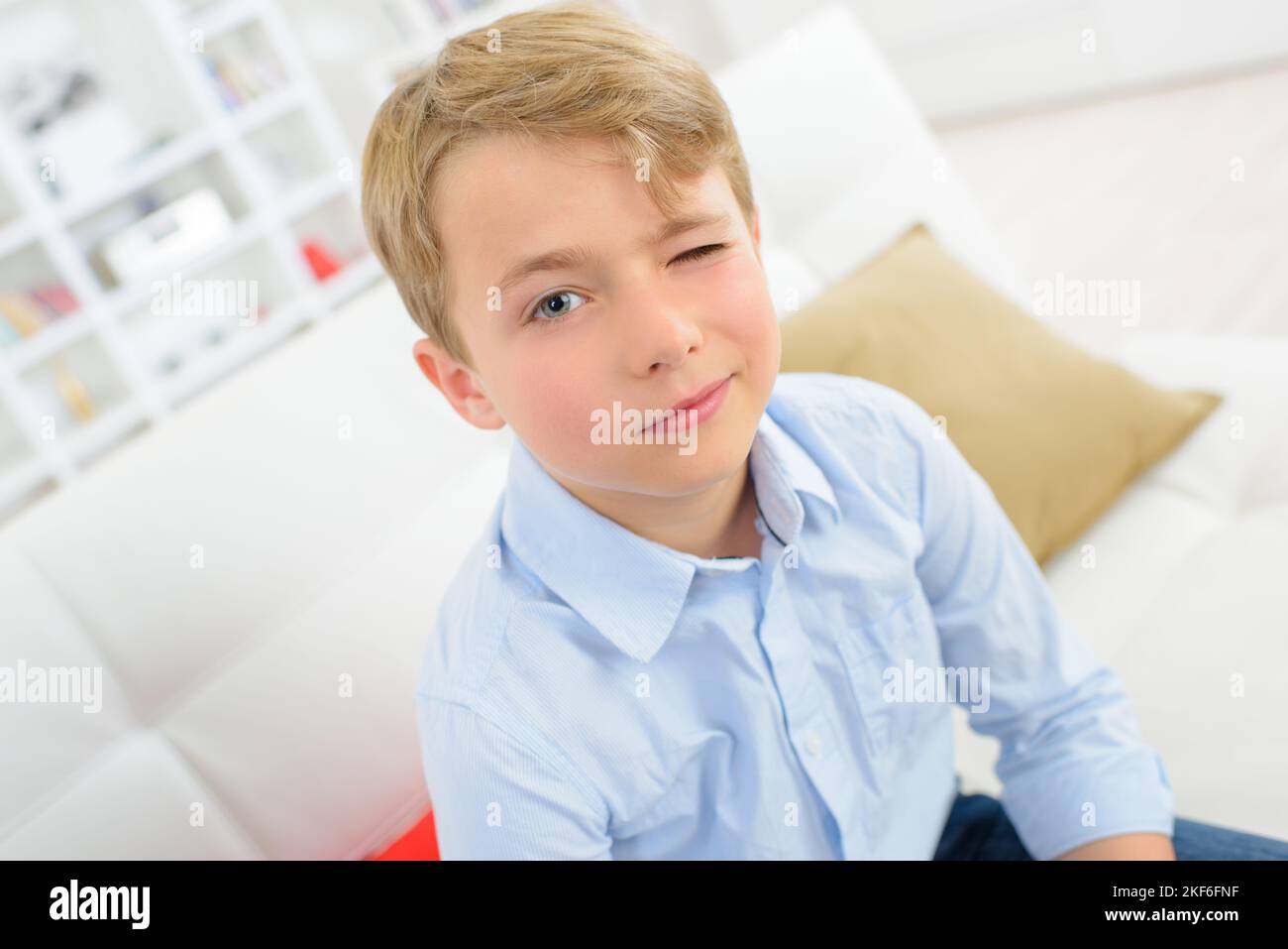 a little boy is winking Stock Photo - Alamy