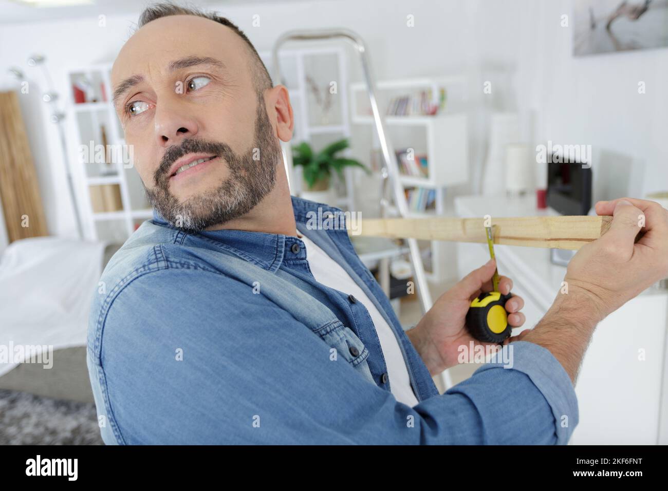 Man doing diy hi-res stock photography and images - Alamy