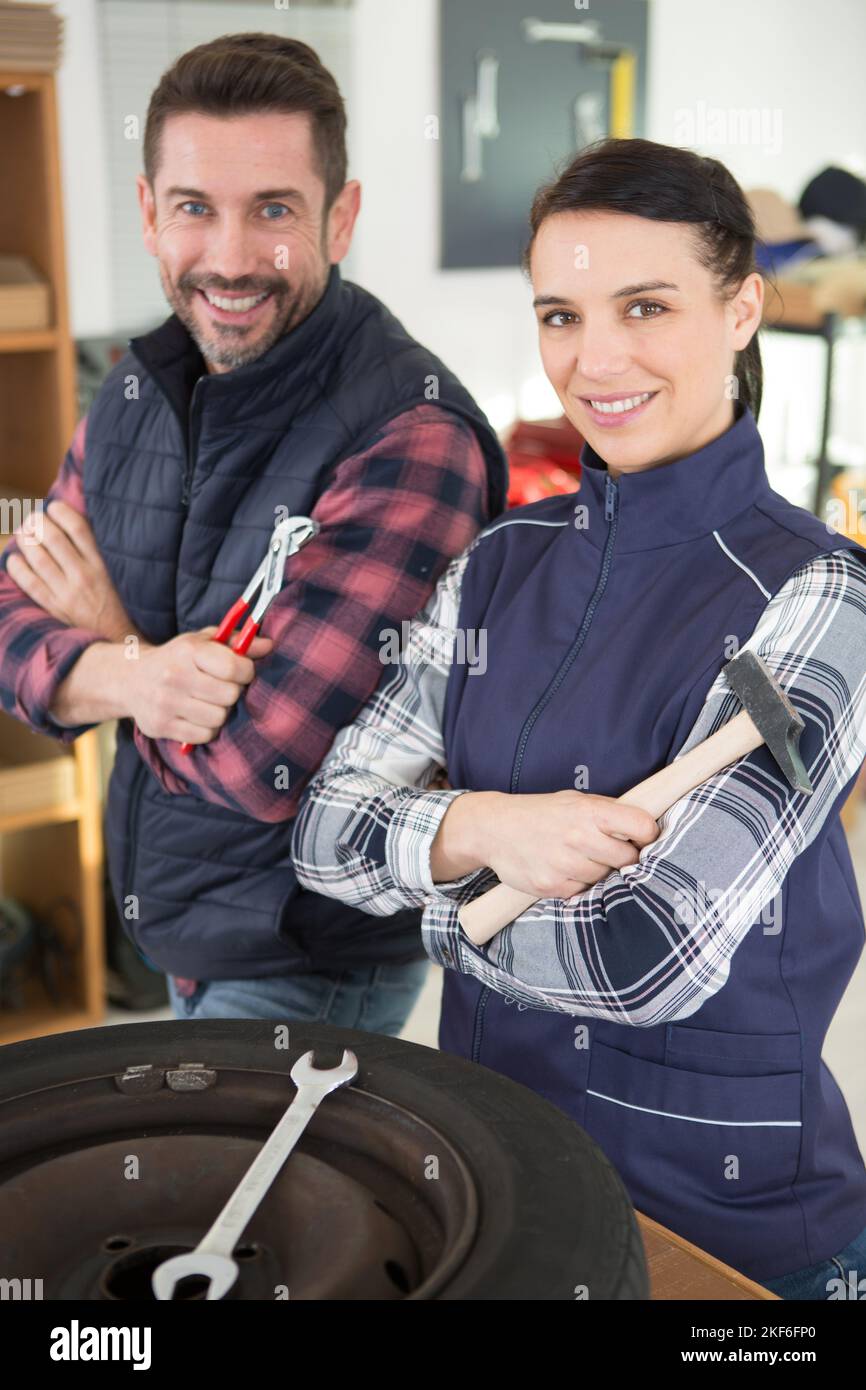 two mechanics smiling at the camera Stock Photo - Alamy