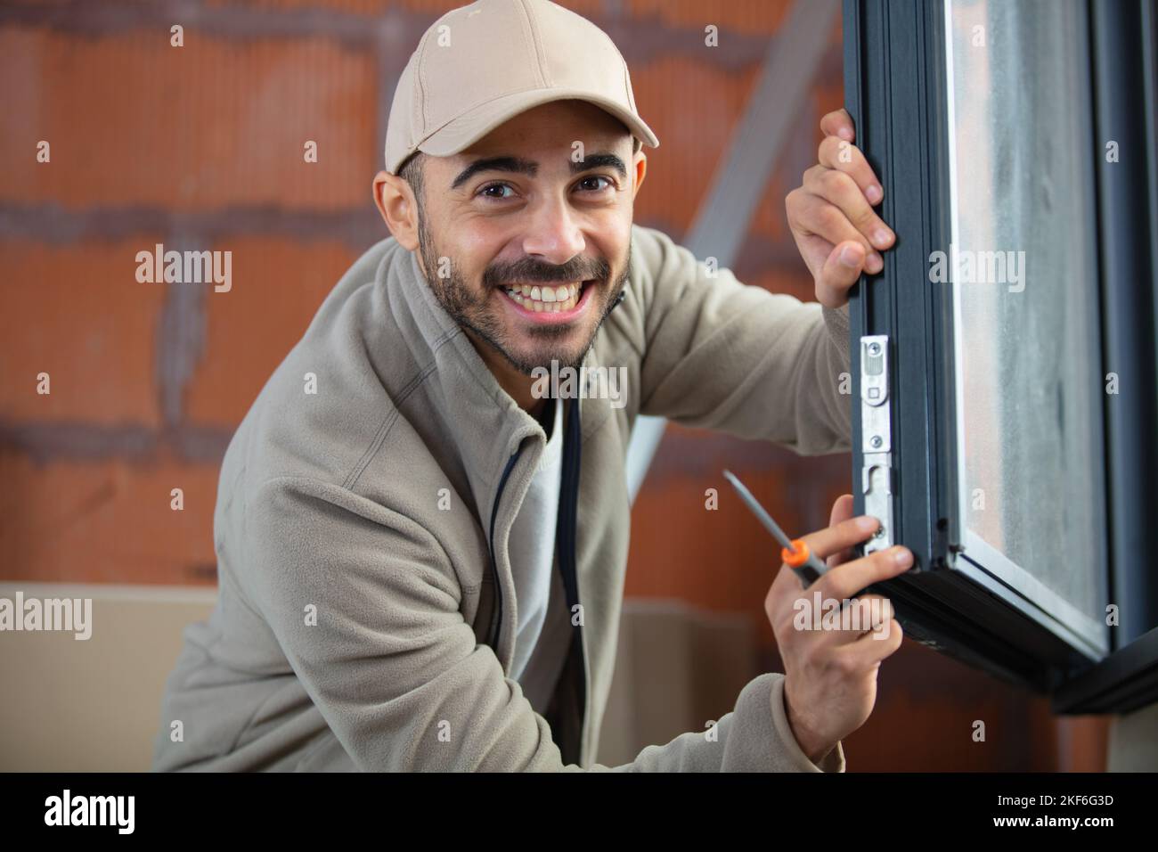 A Builder Installing A Window Stock Photo Alamy
