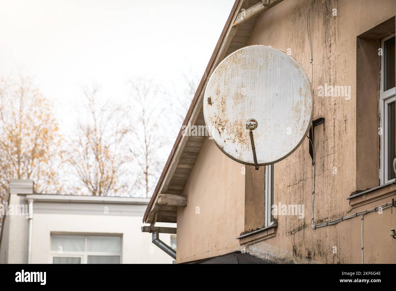 Satellite television dish at the facade of the building Stock Photo - Alamy