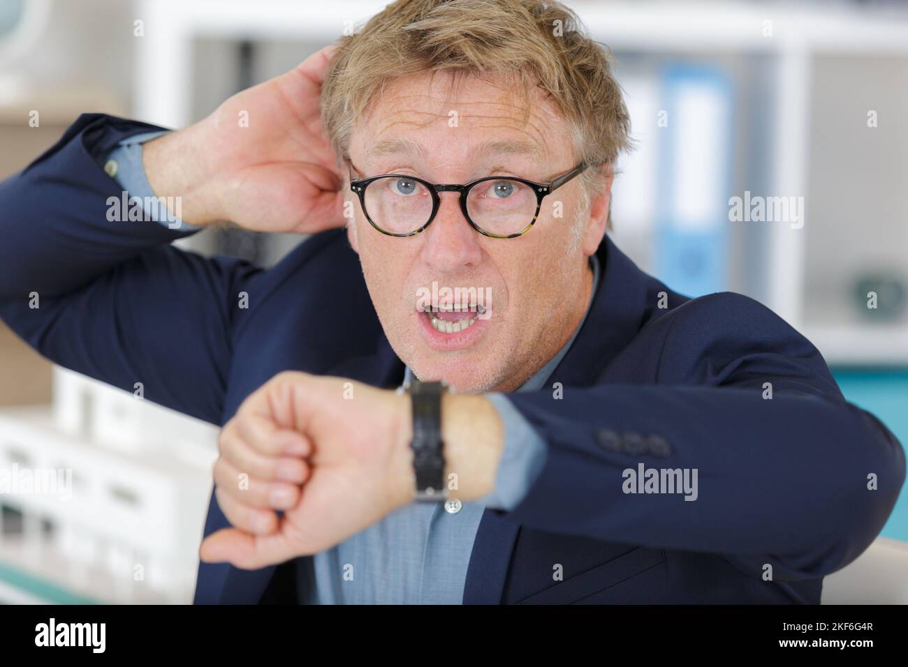 portrait of a man time and management Stock Photo - Alamy