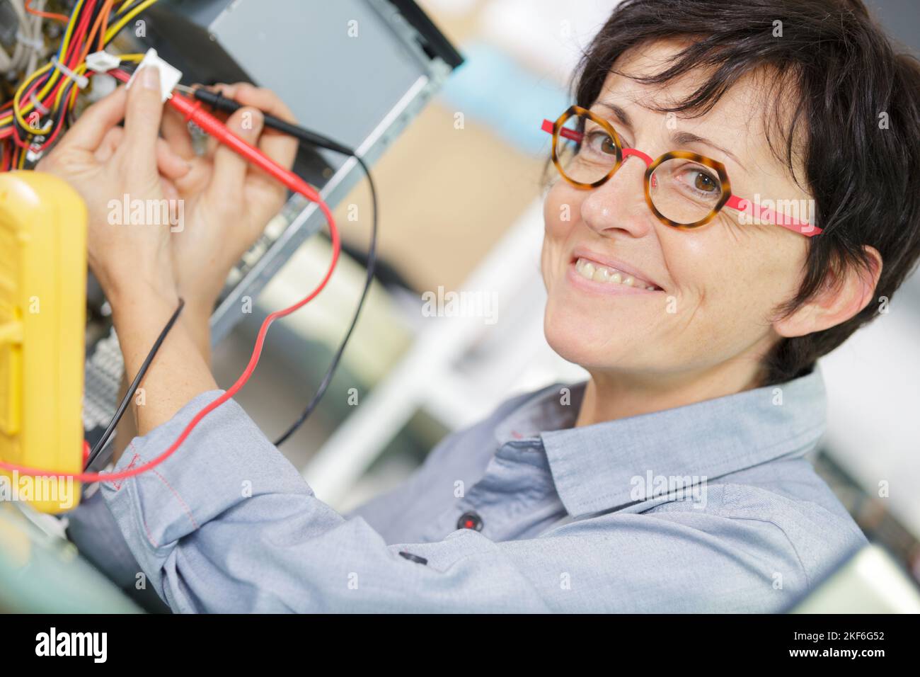 electrician specialist checking low-voltage pc Stock Photo - Alamy