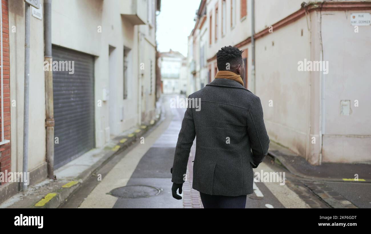 Confident back of black elegant black African man walking Stock Photo ...