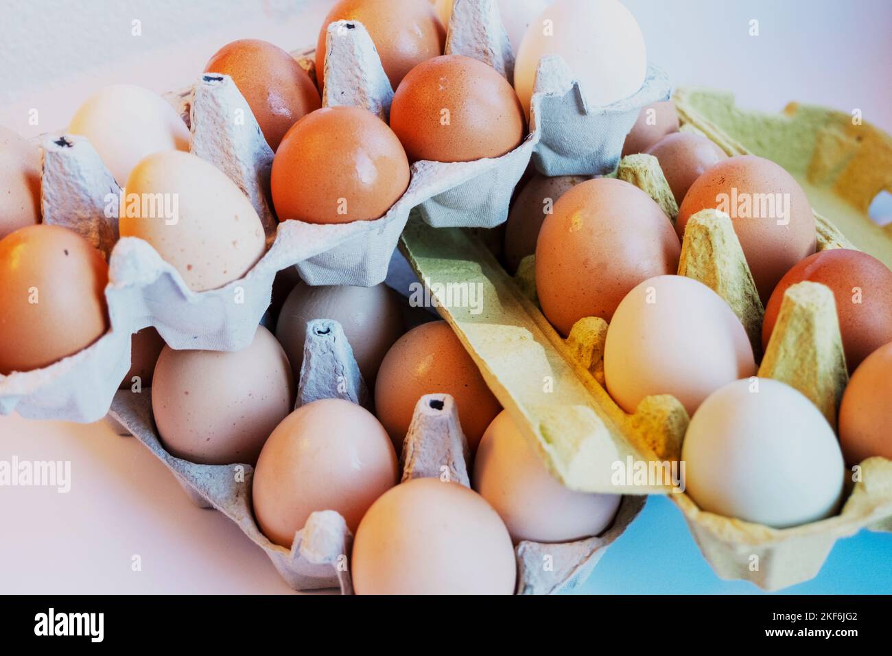 Organic chicken eggs in paper egg box with compartments. Eggs contain vitamins, phosphorus, zinc ...