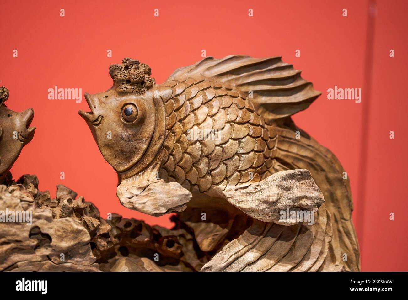A close-up of a delicate and lovely fish-shaped wood carving Stock ...