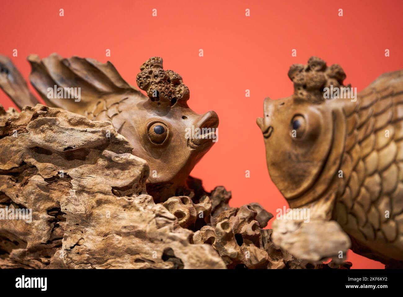 A close-up of a delicate and lovely fish-shaped wood carving Stock ...