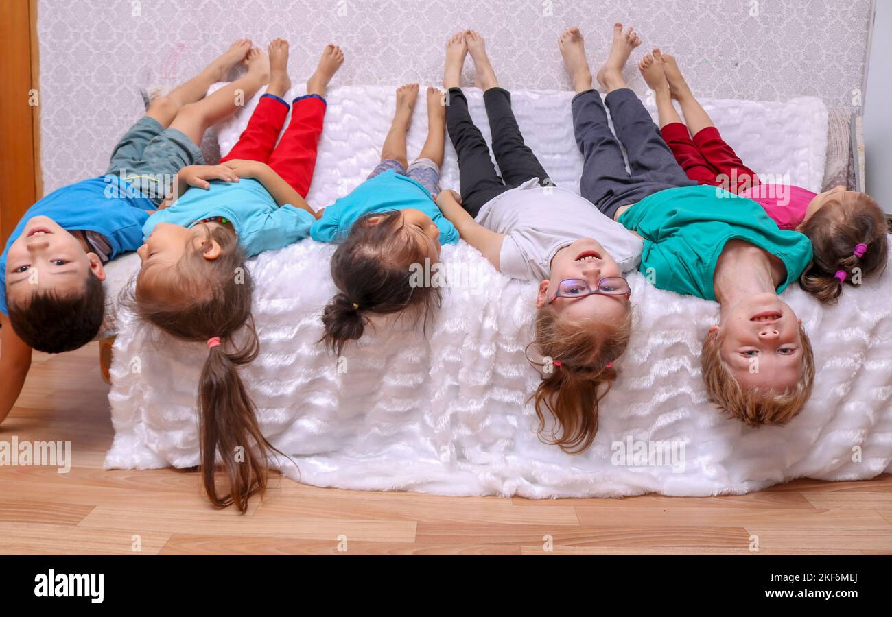 little girls and boy are lying on their backs Stock Photo - Alamy