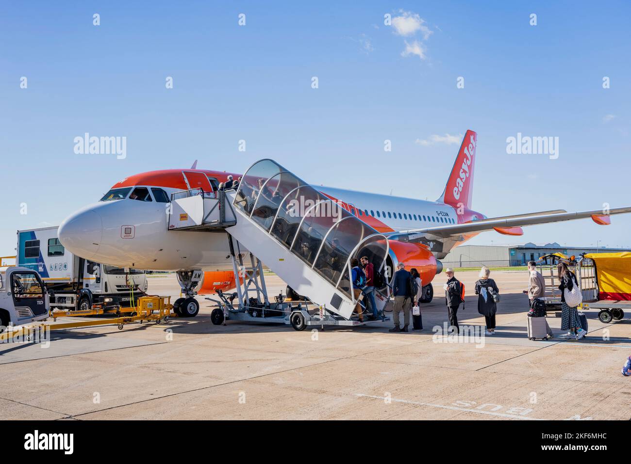 People Boarding An Easy Jet Flight, Gatwick Airport, West Sussex, UK ...