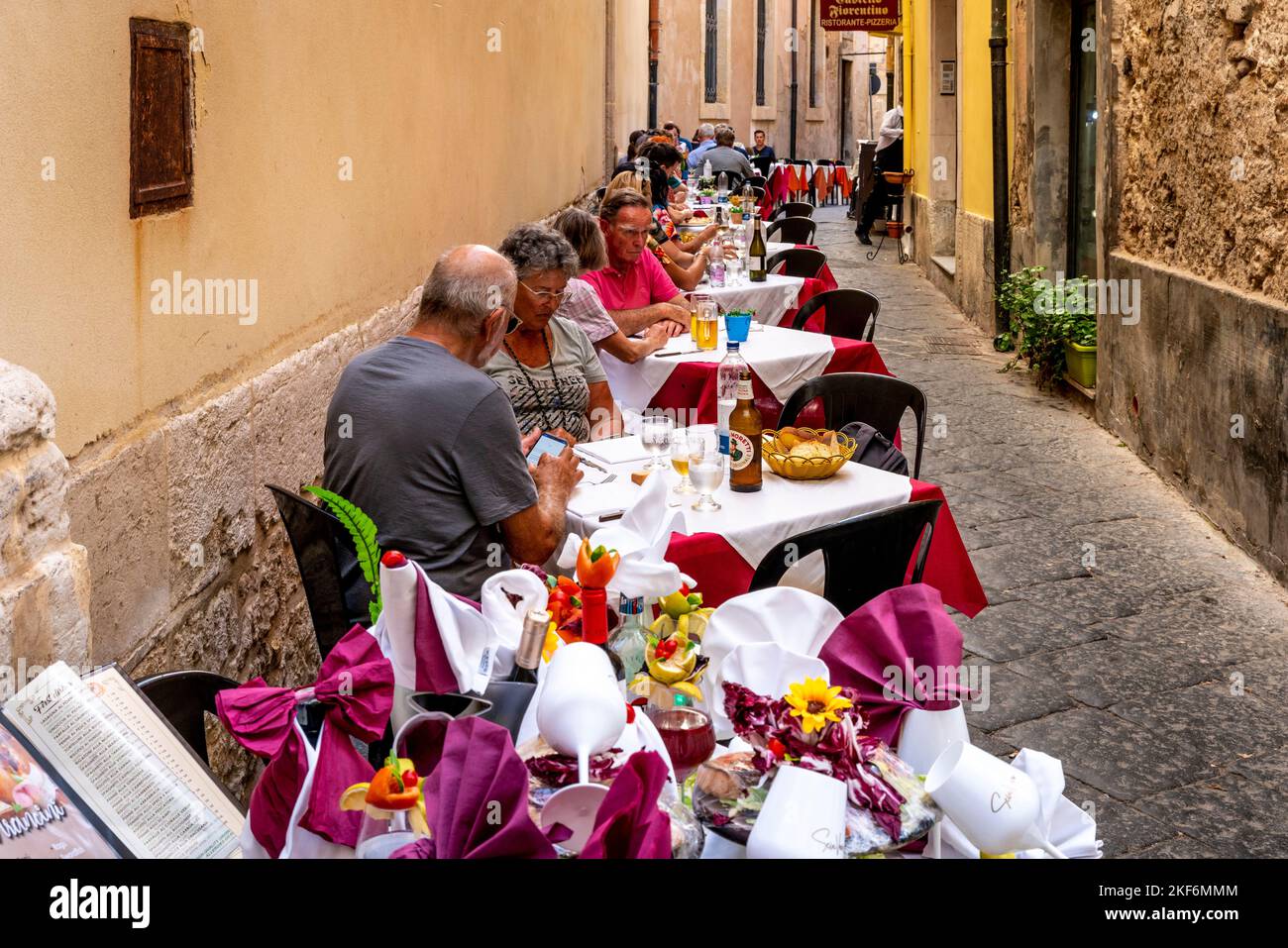 People Sitting Down Eating Lunch At A Restaurant In Ortigia, Syracuse ...