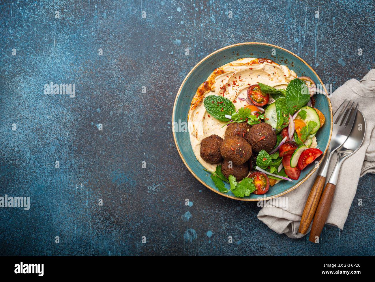 Middle Eastern Arab meal with fried falafel, hummus, vegetables salad ...