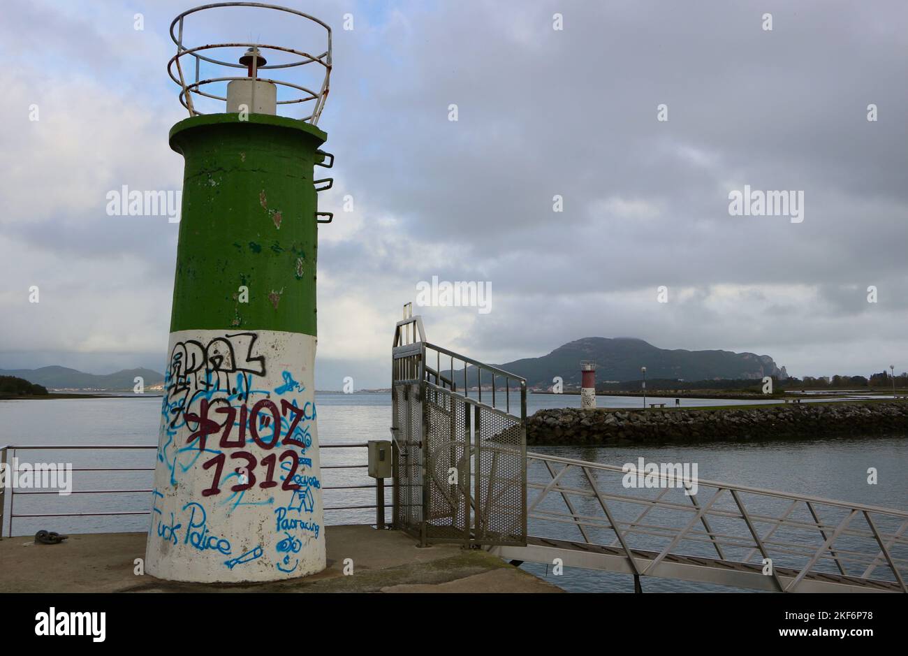 Red and green navigation marker posts at the entrance to the fishing ...