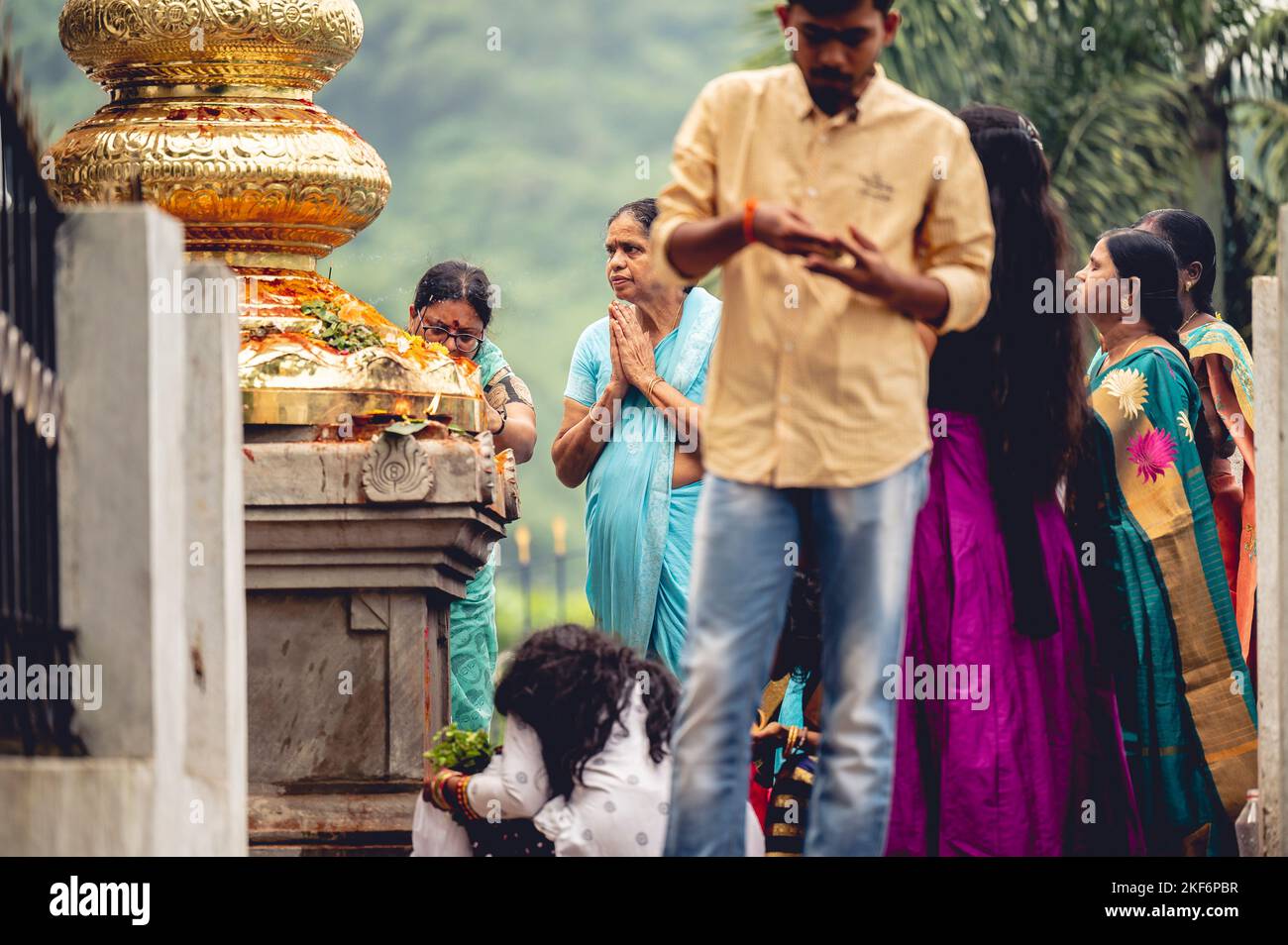 The women praying to idols and guards at the Narasimha Hindu temple in ...