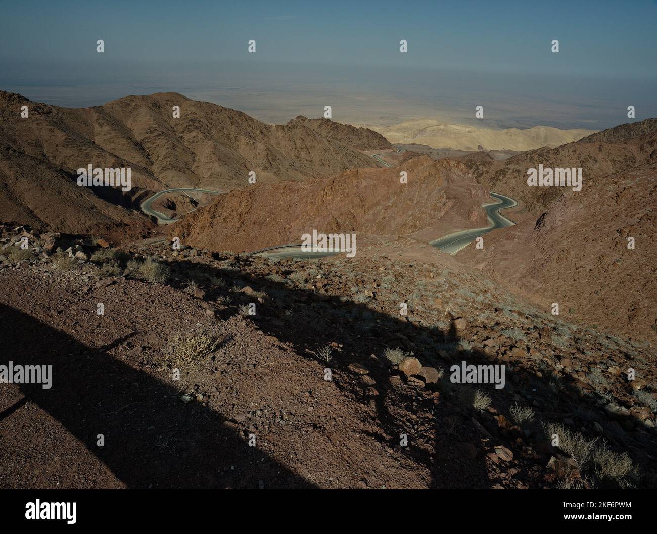 A winding twisting mountain road from Wadi Musa sandstone hills of ...