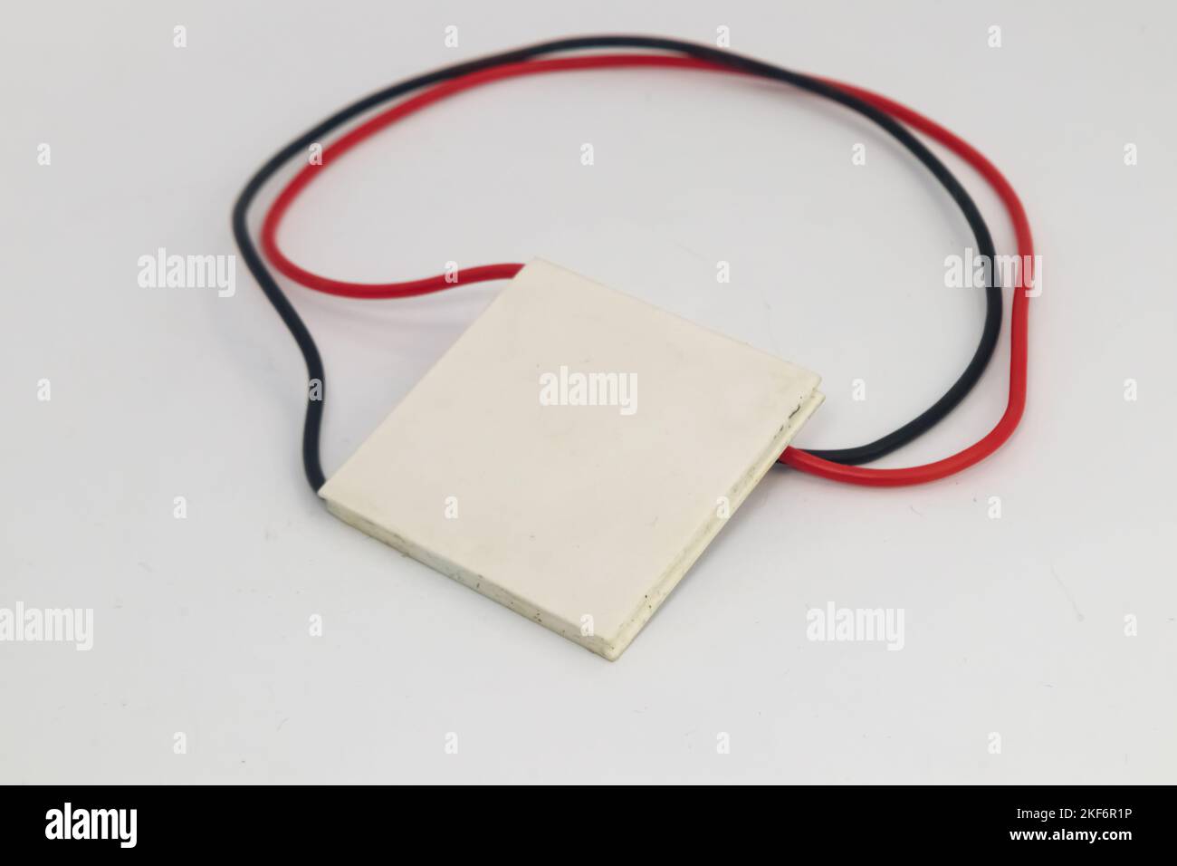Top view of the Peltier temperature sensor with circular red and black ...