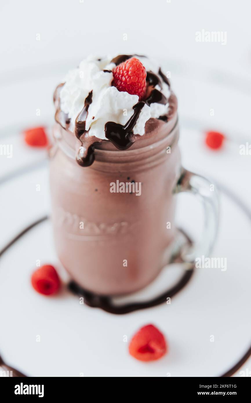 A closeup shot of an appetizing raspberry chocolate milkshake Stock ...