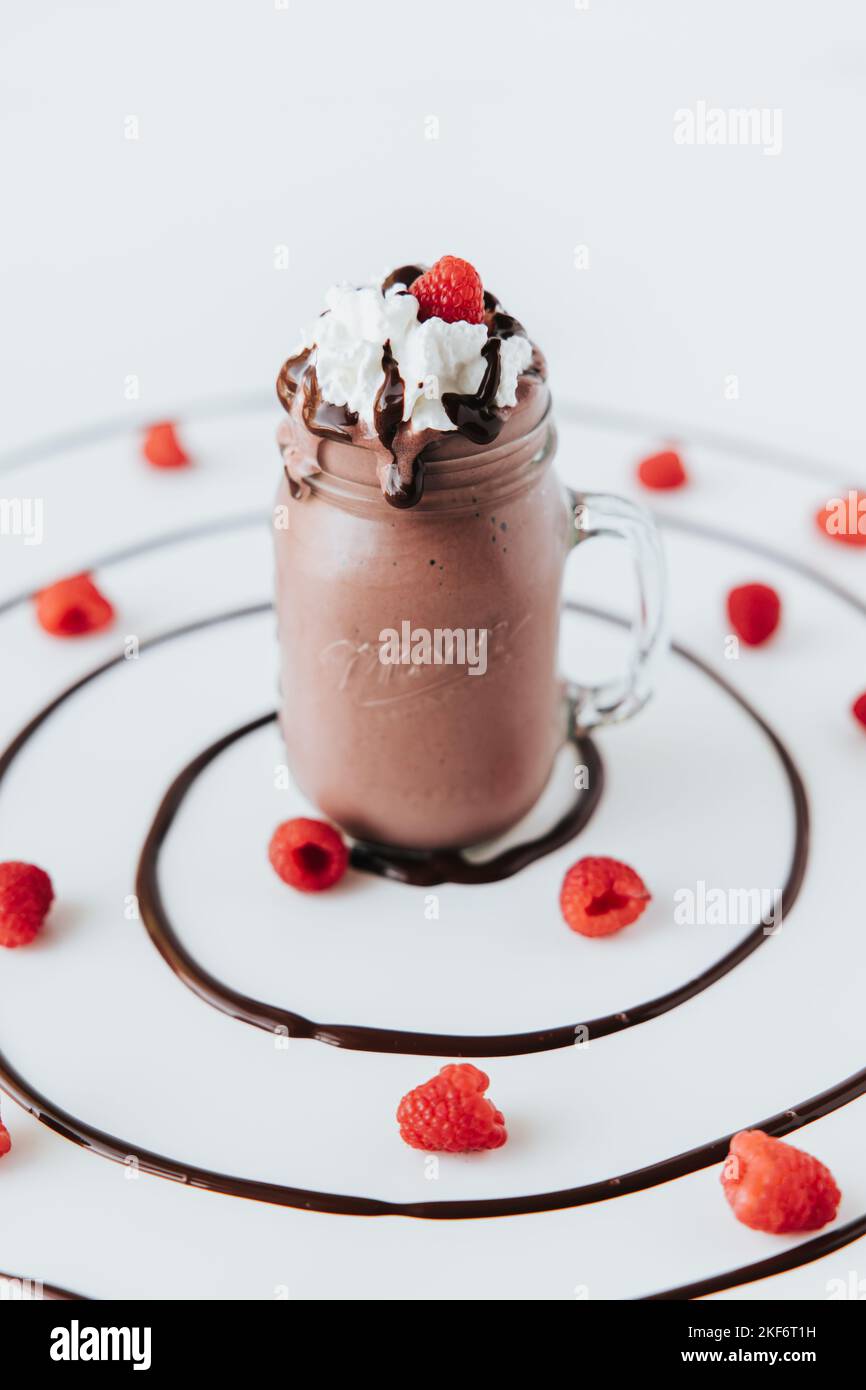 A closeup shot of an appetizing raspberry chocolate milkshake Stock ...